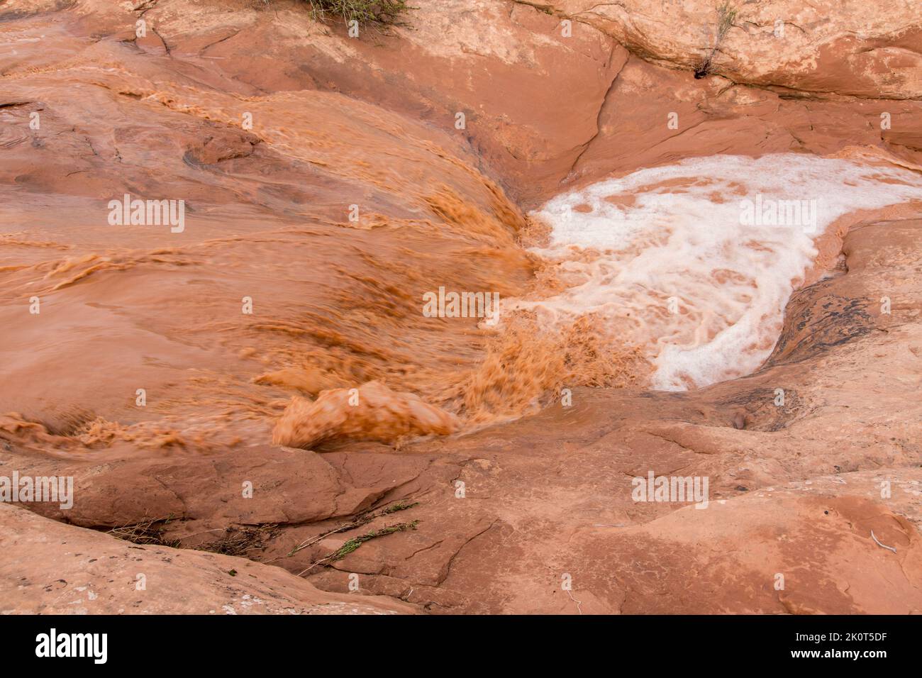 A flash flood in the desert after a heavy rain in Arches National Park ...