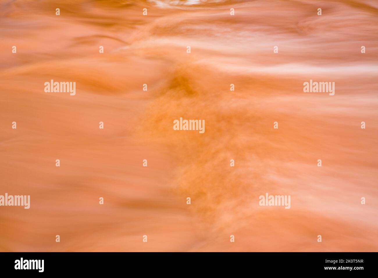 An abstract of muddy flash flood water in the desert after a heavy rain ...