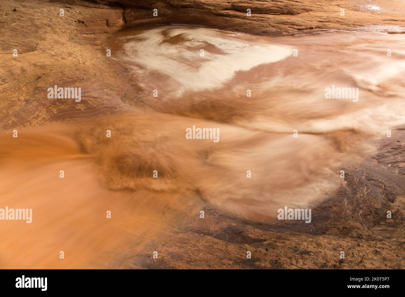 A flash flood in the desert after a heavy rain in Arches National Park ...