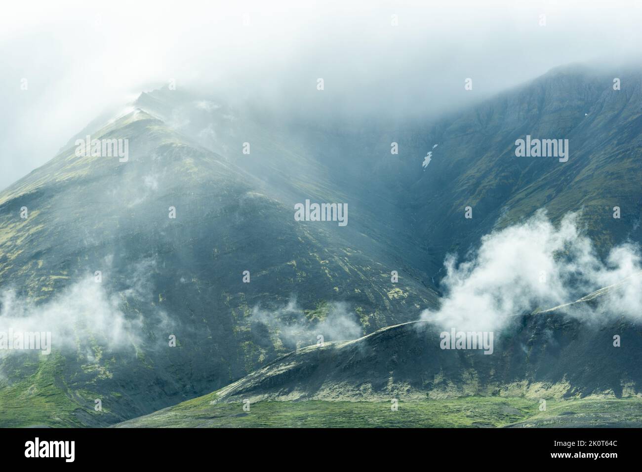 Fog and mist over mountains in Iceland - HDR photograph Stock Photo - Alamy
