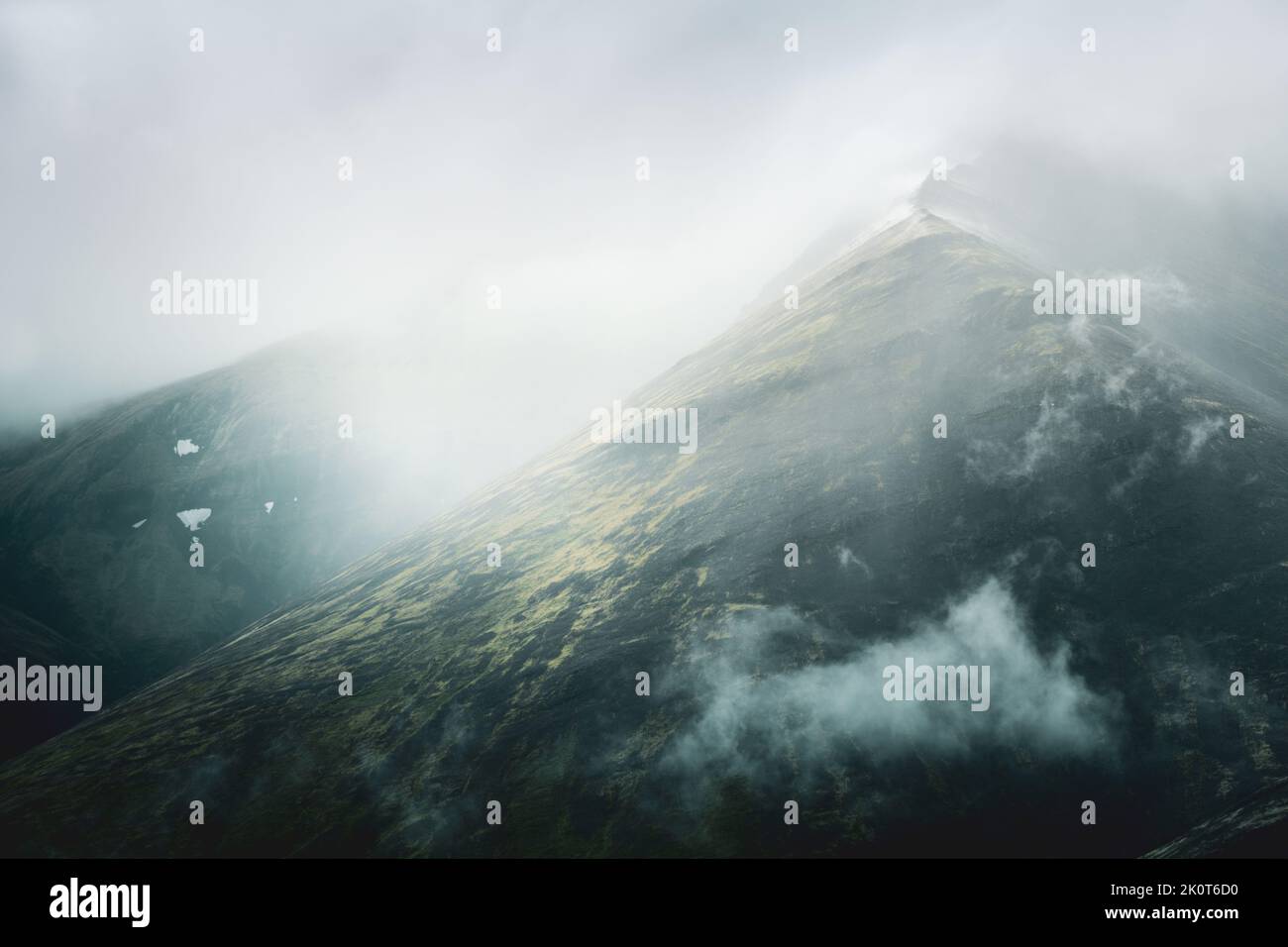 Fog and mist over mountains in Iceland - HDR photograph Stock Photo - Alamy