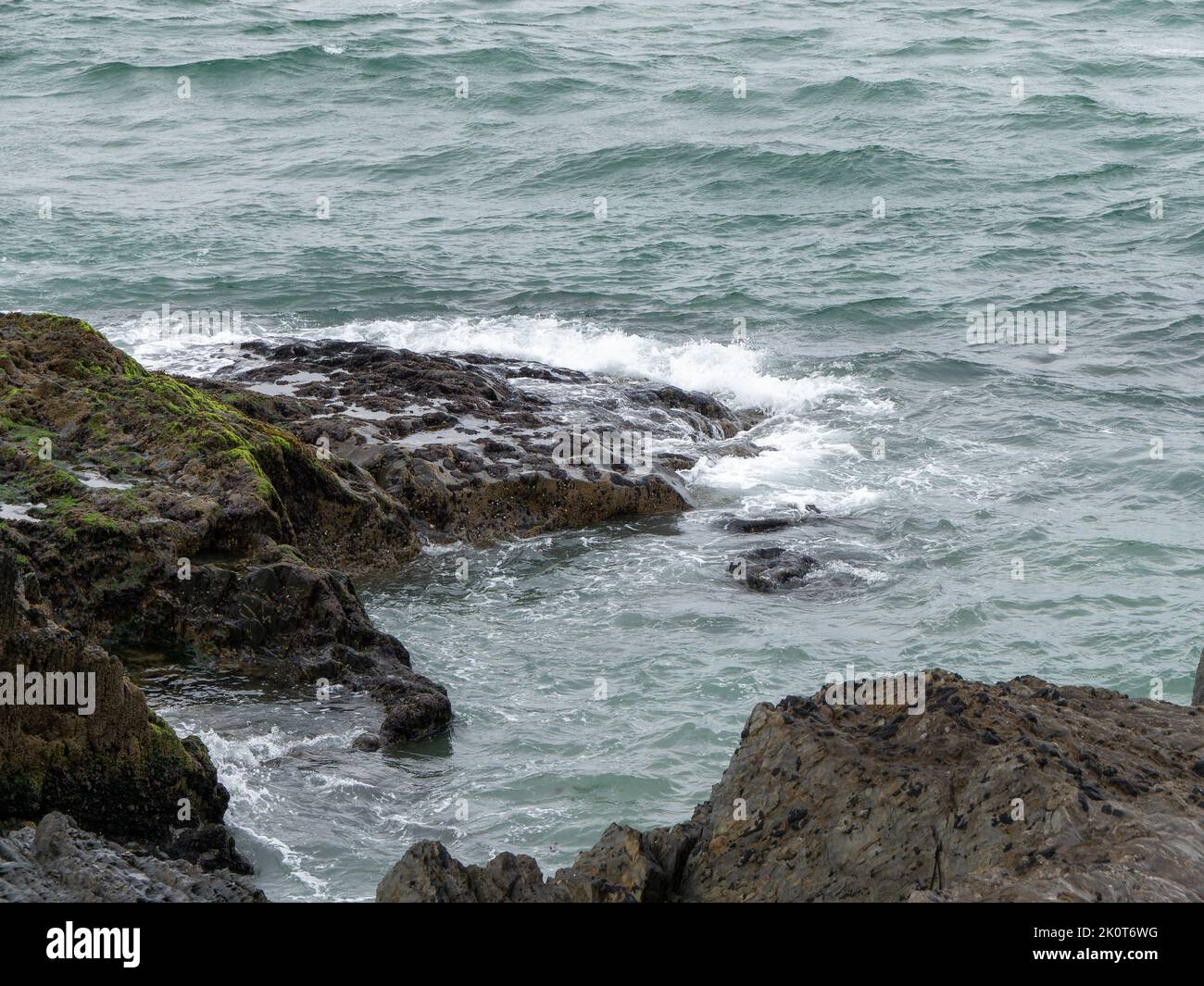 Wild rock, rock formation beside body of water. Ocean waves & Coastal ...