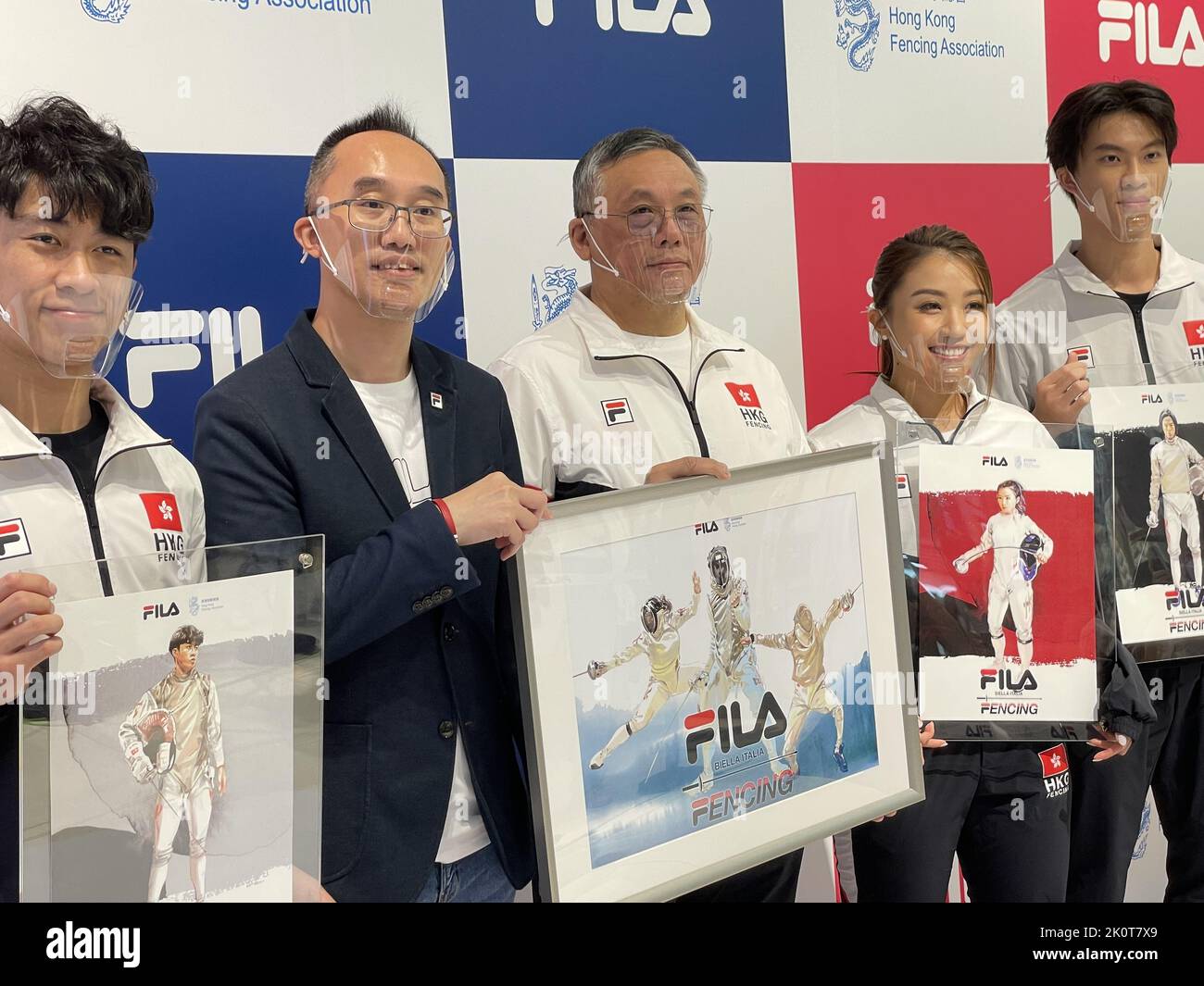 Fencing Association chairman Yeung Wing-sun (centre) and fencers (from ...
