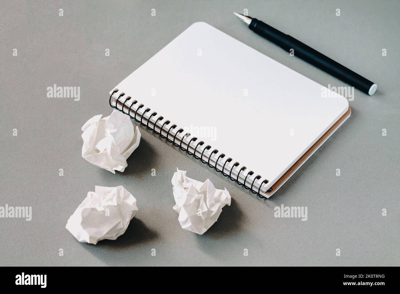 Open blank notepad, pen and crumpled paper on office desk. Education or ...
