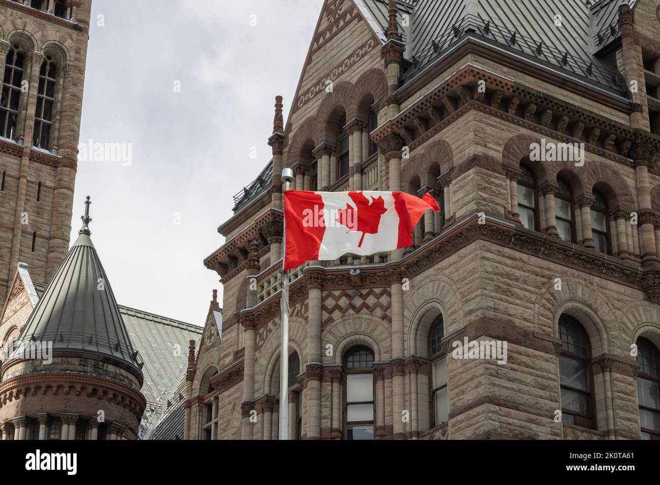 A beautiful Canada flag waving in front of the Toronto Old City Hall ...
