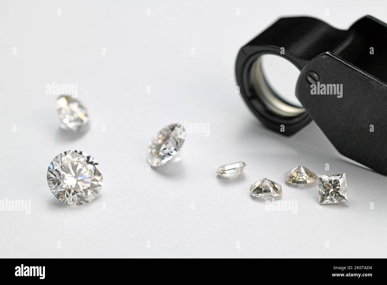 Luxury Diamonds and Magnification Loupe on White Background Stock Photo ...