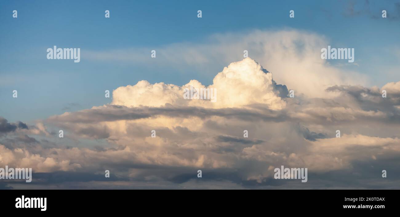 Puff Clouds in the Sky during sunset. Zoom in Stock Photo - Alamy