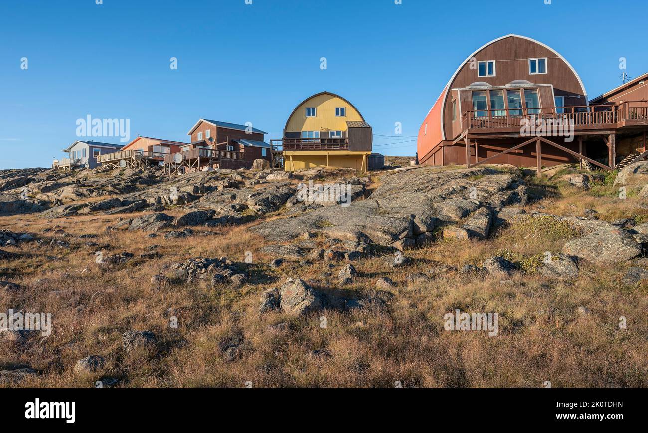 Houses on a rocky ridge in the city of Iqaluit in Nunavut, Canada Stock ...