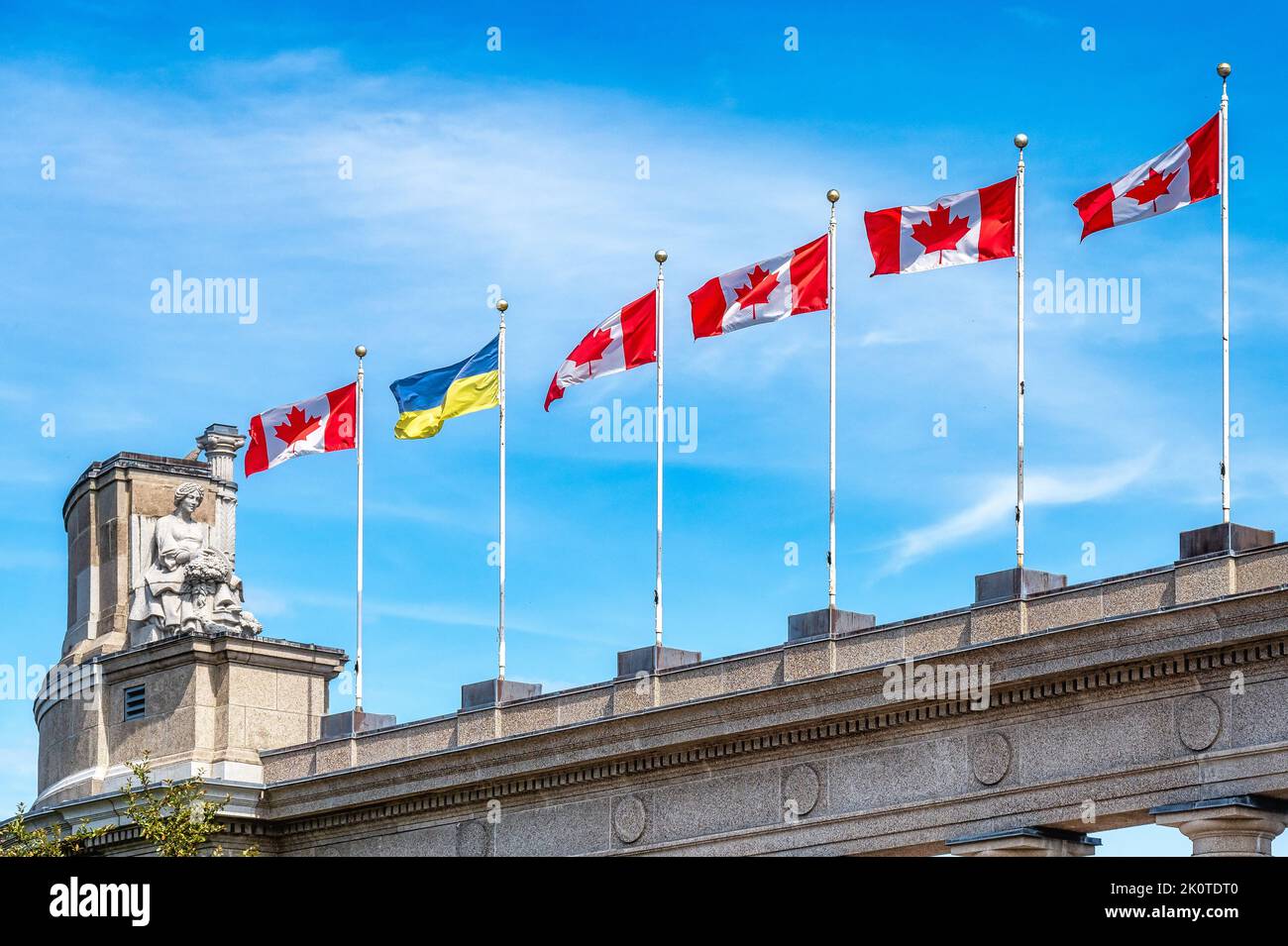 A group of Canadian flags alongside one Ukrainian flag in Exhibition ...