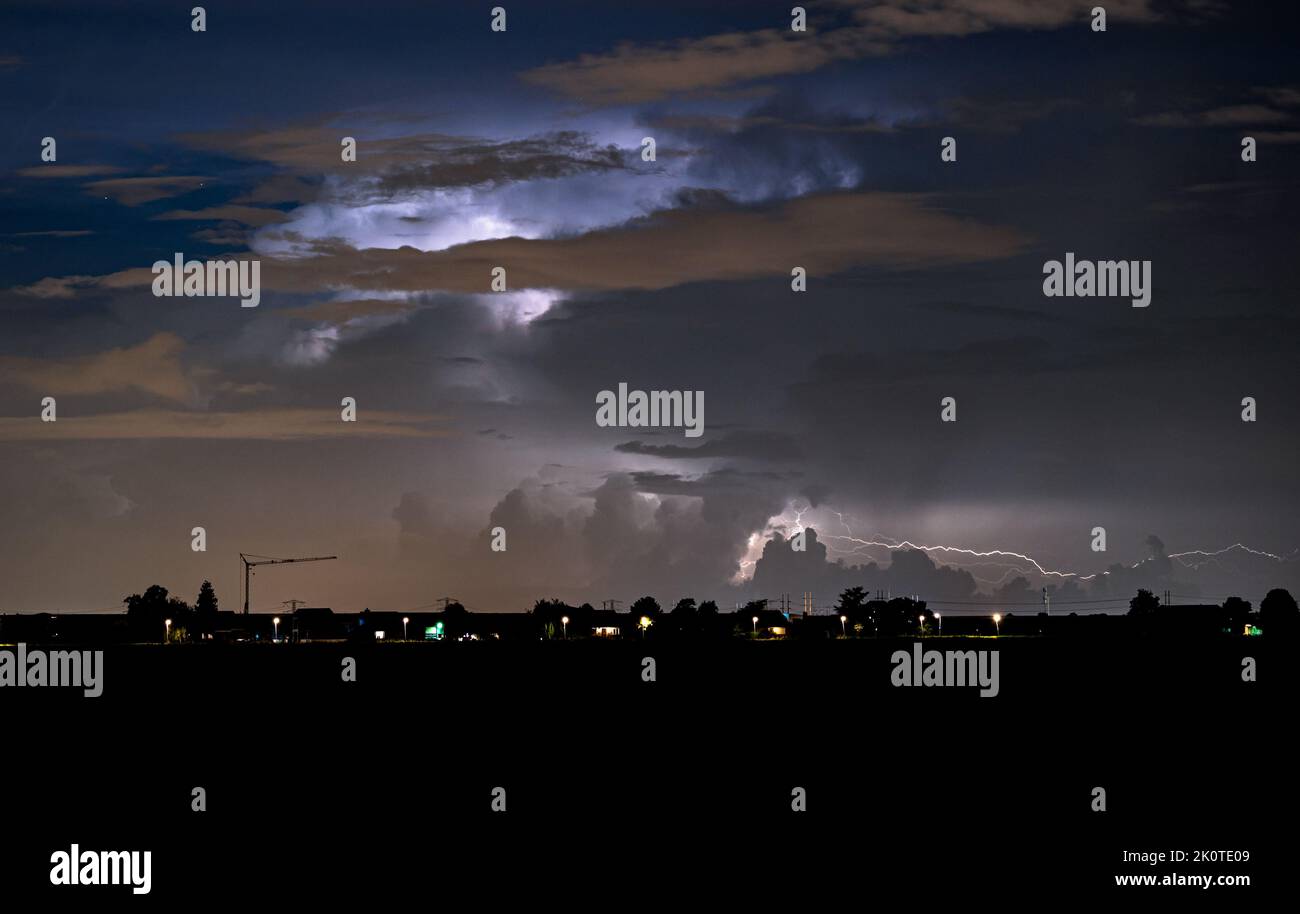 Thunderstorm over western Netherlands is illuminated from inside by ...