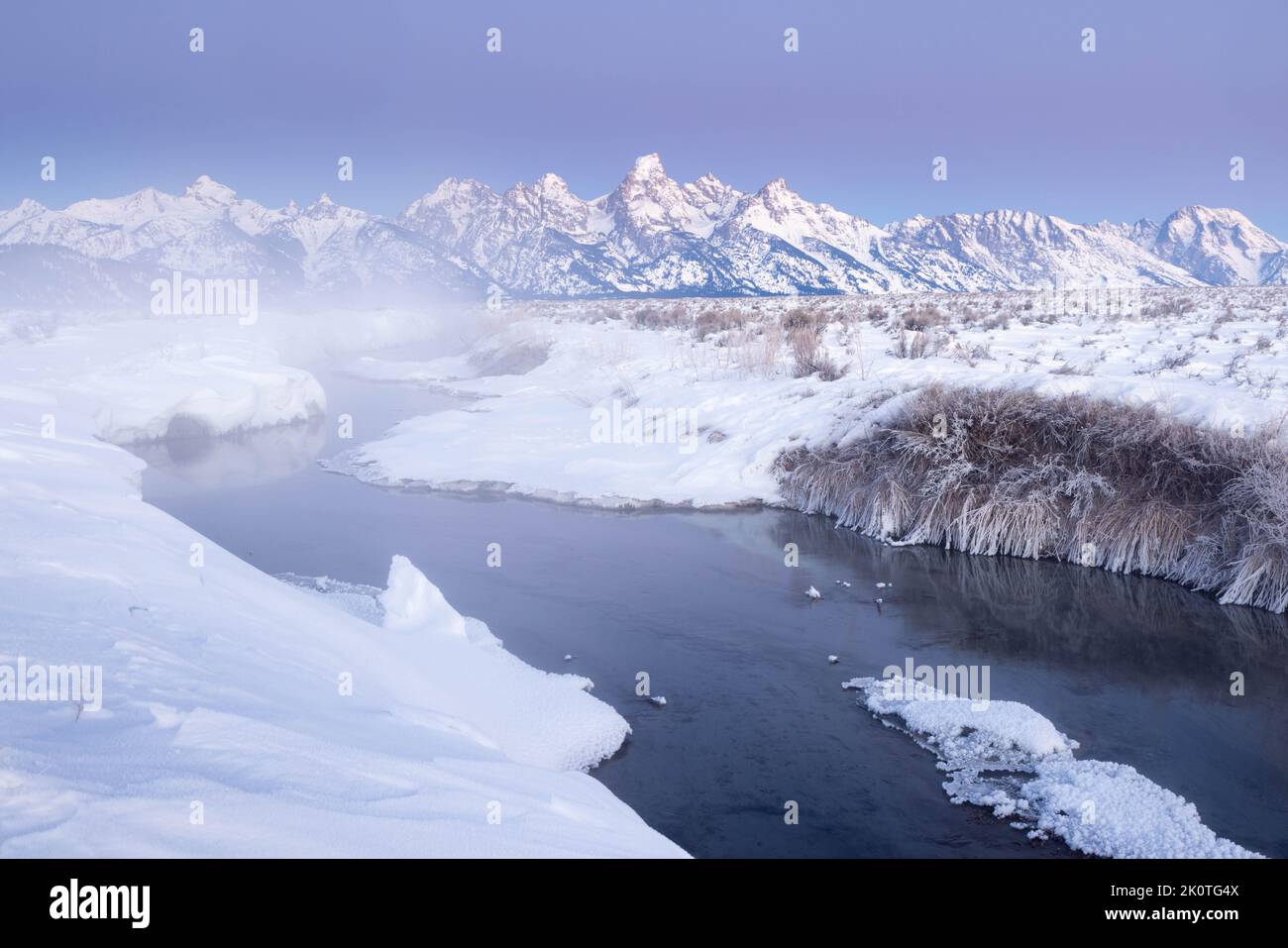 Earth's shadow settling over the Teton Mountains and the runoff from ...