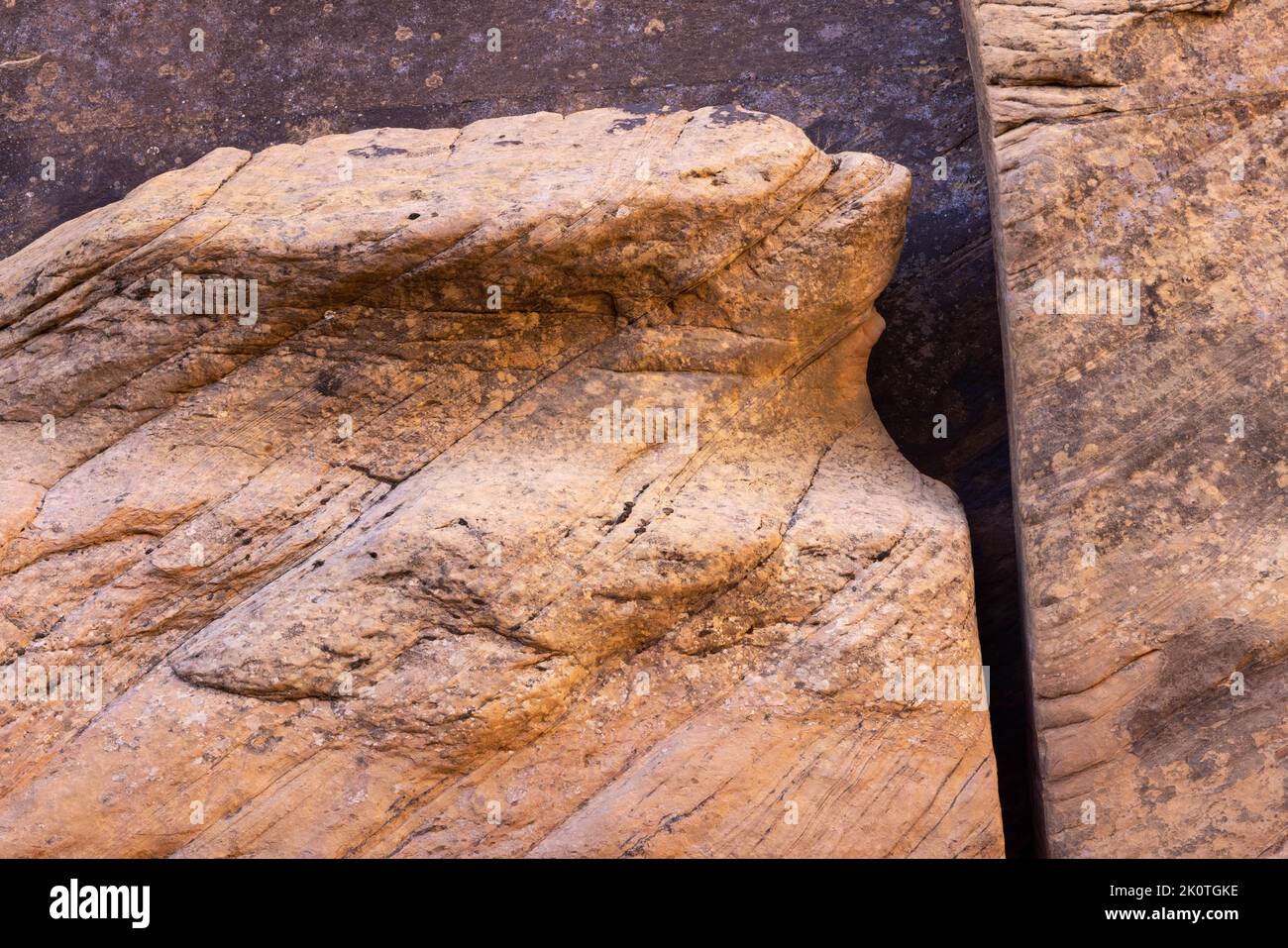 Broken sandstone rocks creating abstract patterns against a deeper ...