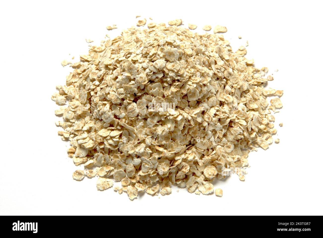 A pile of porridge oats on white background Stock Photo - Alamy