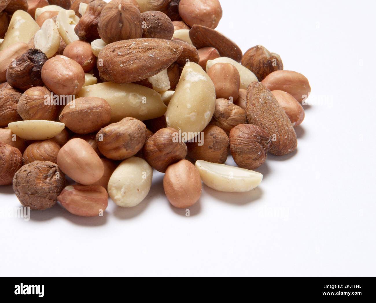 Selection of organic mixed nuts on white background Stock Photo - Alamy