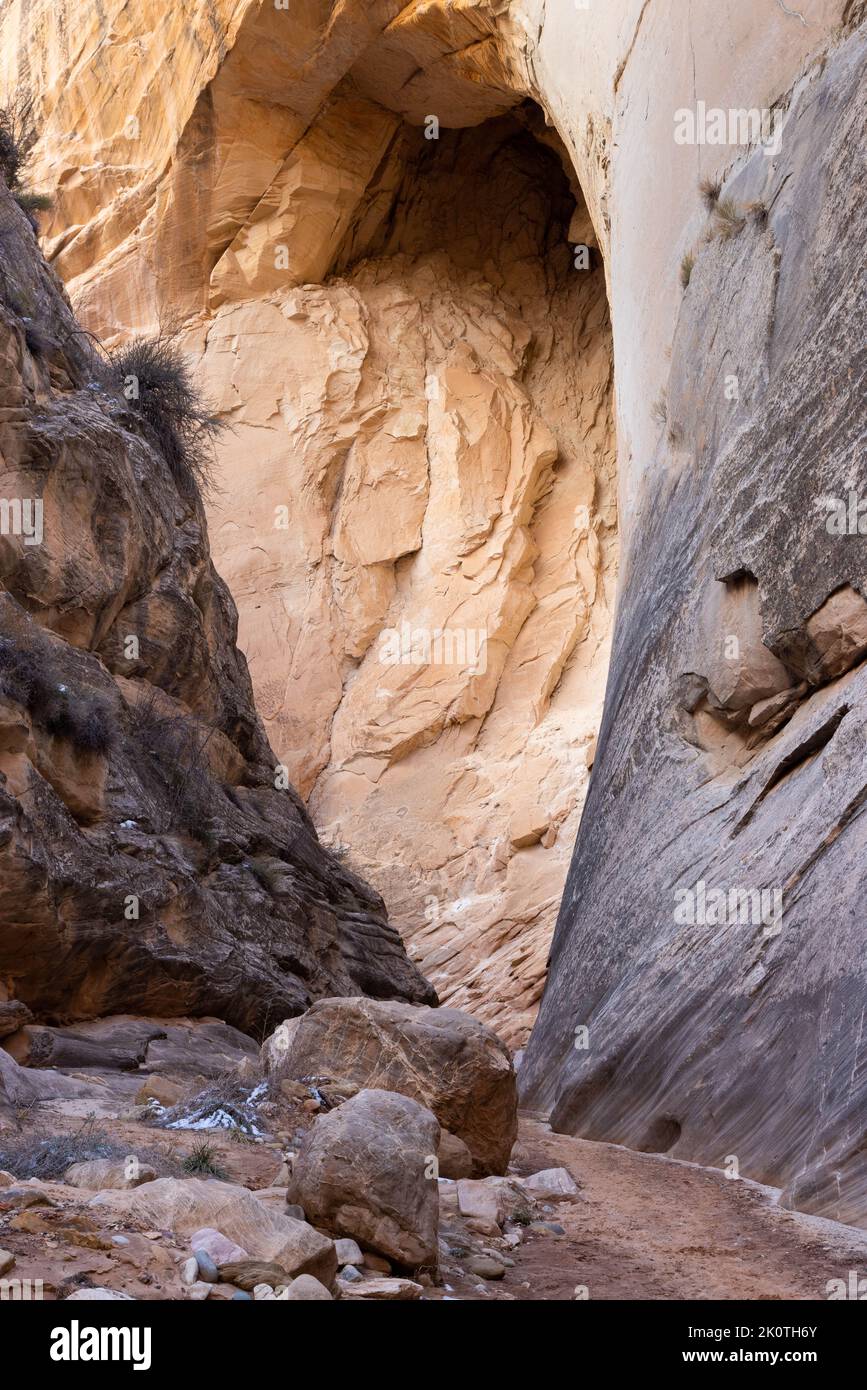 A large eroded alcove rising high above the Cottonwood Narrows Trail ...