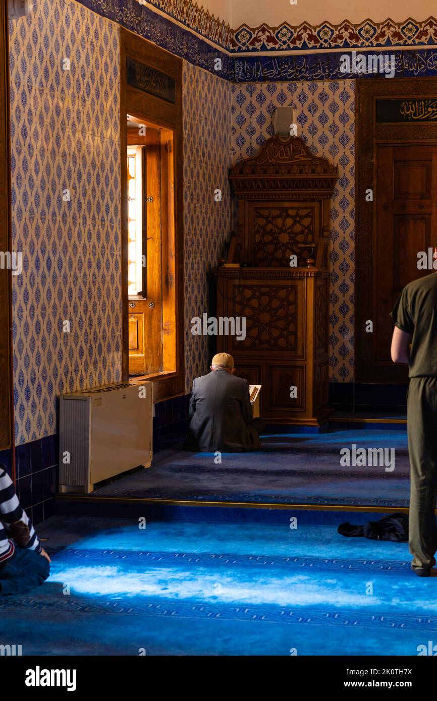 Islamic story photo. Muslim elder man reading the Holy Quran in a ...