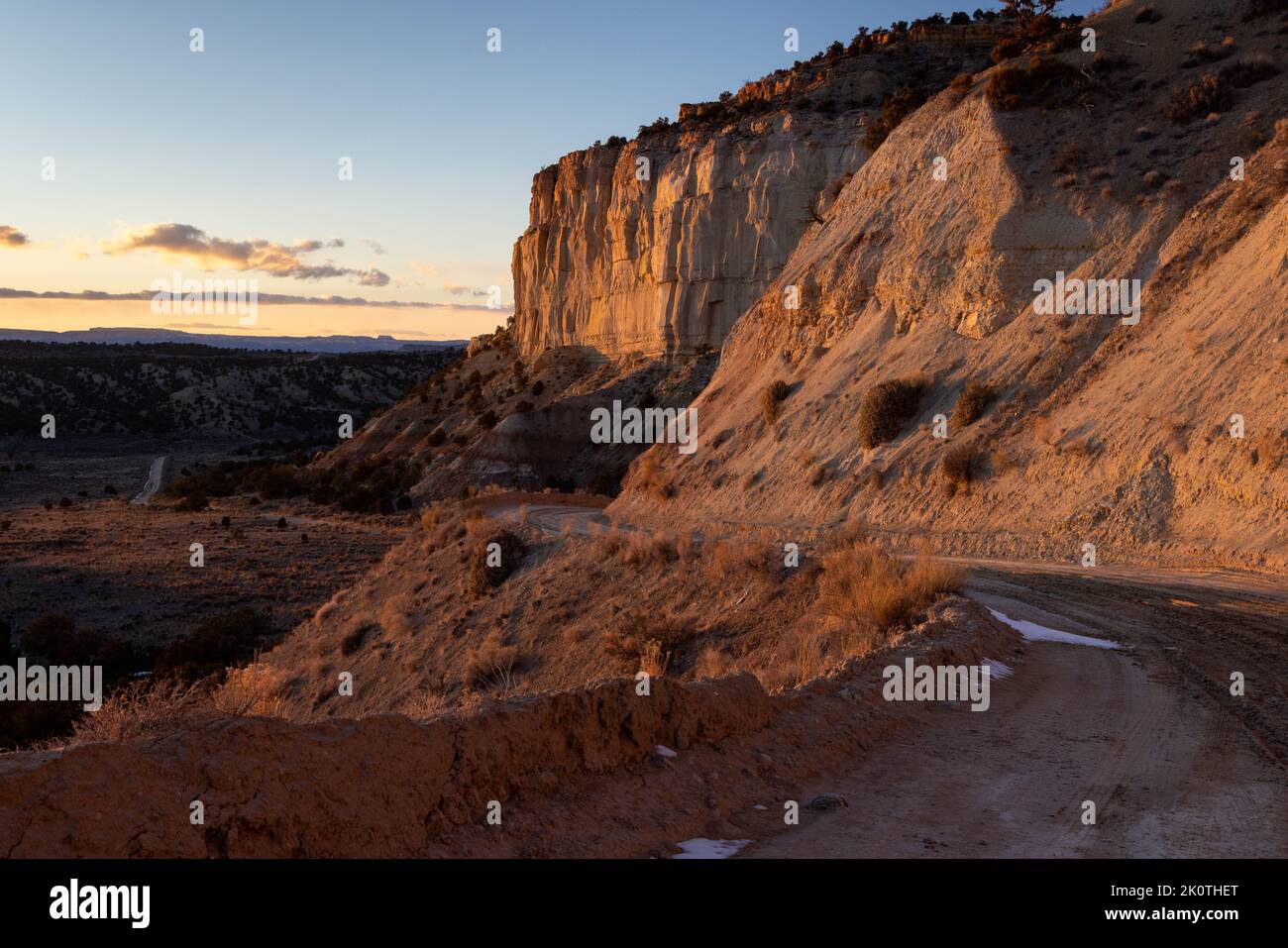 The Straight Cliffs rising above Cottonwood Canyon Road at sunset ...