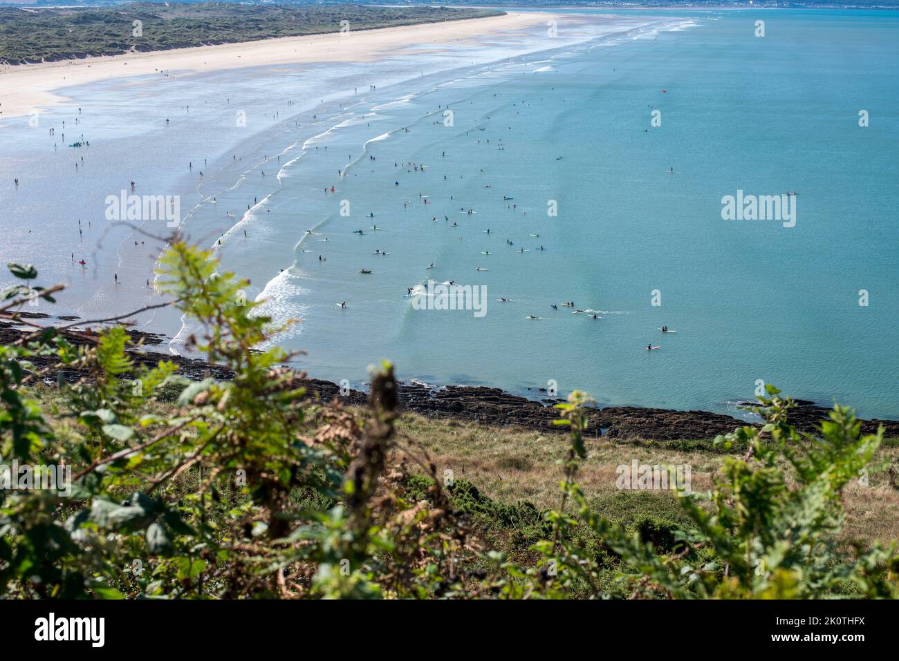 Elevated view of surfers enjoying the waves at Saunton Sands in North ...