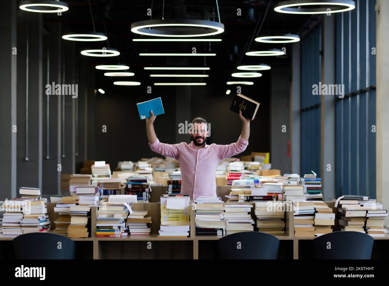 College student reading books in a library Stock Photo - Alamy