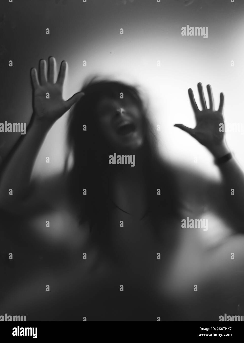 Horror ghost woman behind the matte glass. Halloween festival concept ...