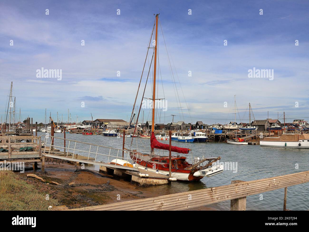 The river Blyth at Walberswick Suffolk with moored boats and wooden ...