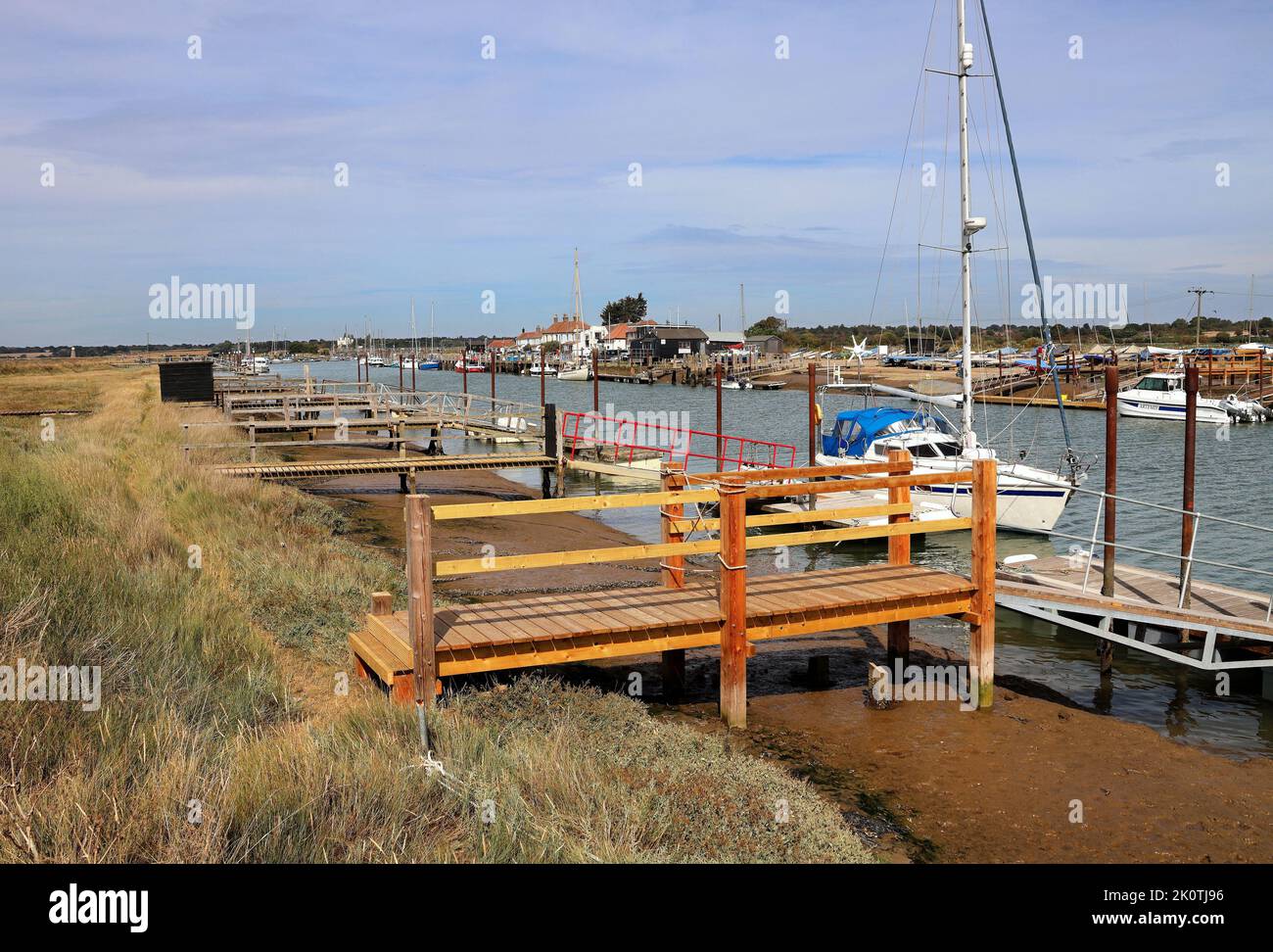 The river Blyth at Walberswick Suffolk with moored boats and wooden ...