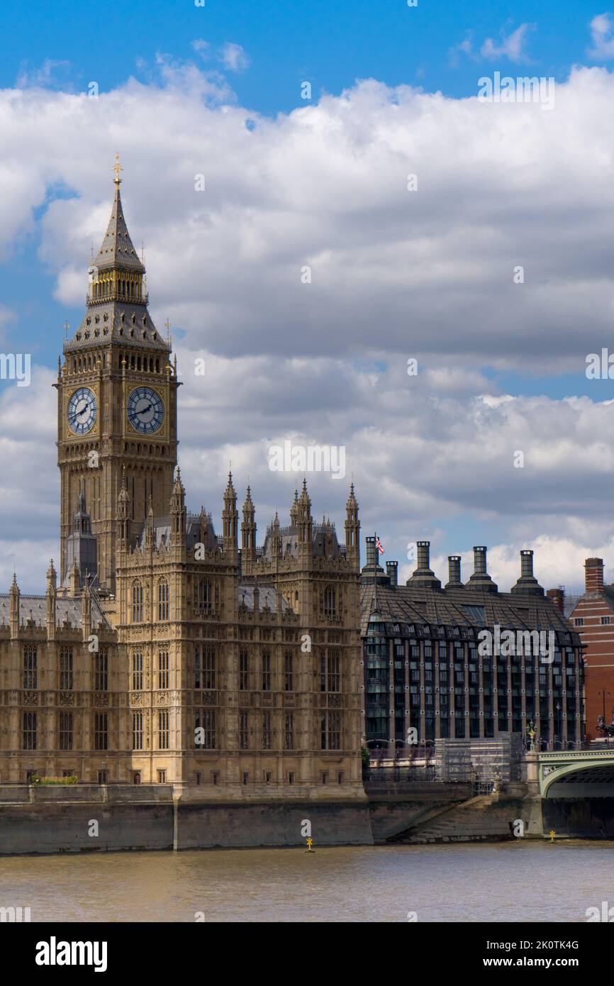 View of London Big Ben tower with British parliament against partly ...