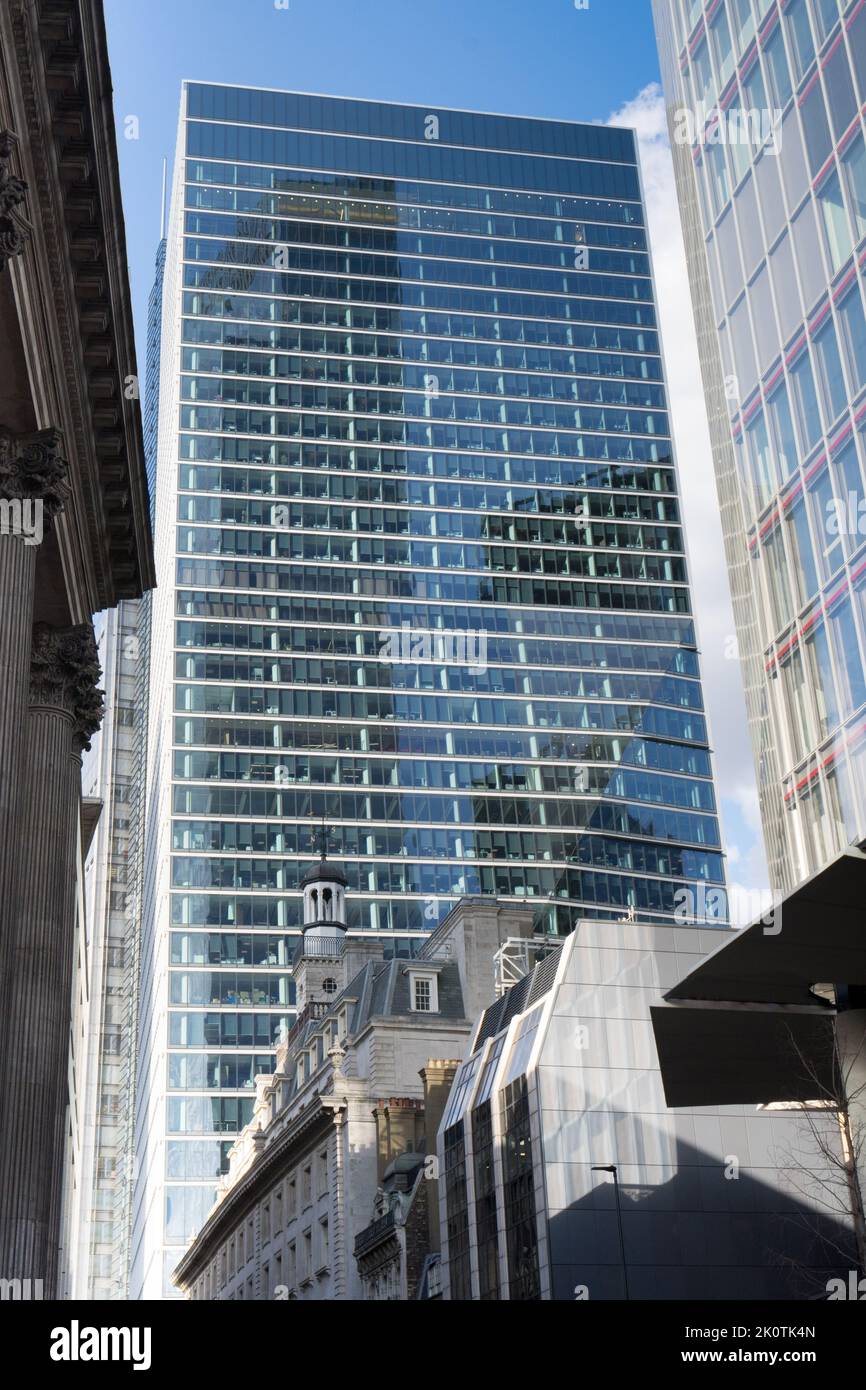 City view in London of glazed towering skyscraper behind historical low ...
