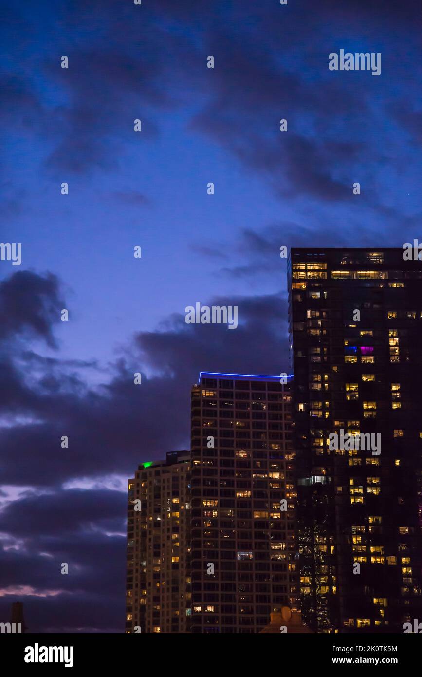 Detail of high-rise architecture at night against moody sky, Downtown ...