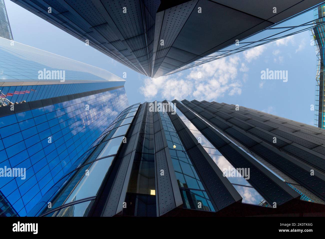 view up between high rise skyscraper buildings in downtown city center ...