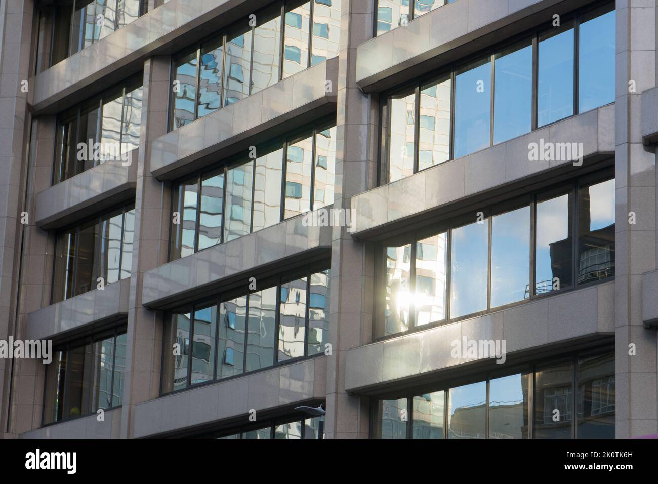 Partial view of a downtown building with concrete facade of a several ...