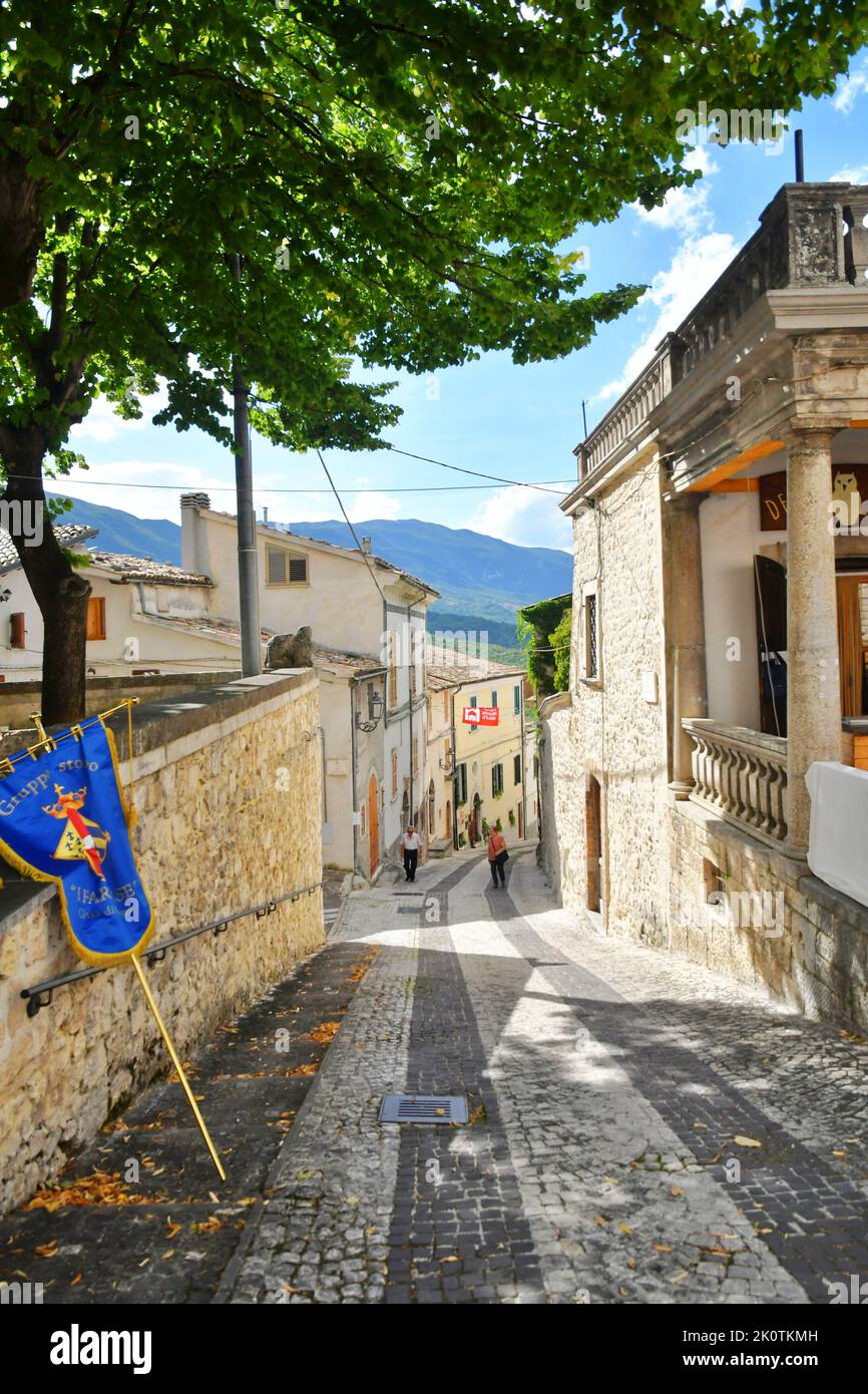 A narrow street between the old stone houses of Caramanico Terme, a ...