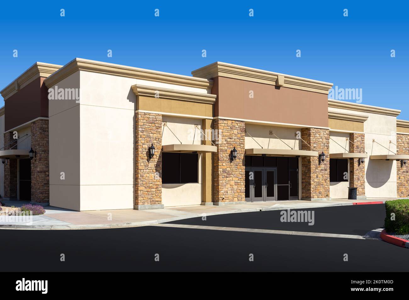 New commercial retail office building with blue sky Stock Photo - Alamy