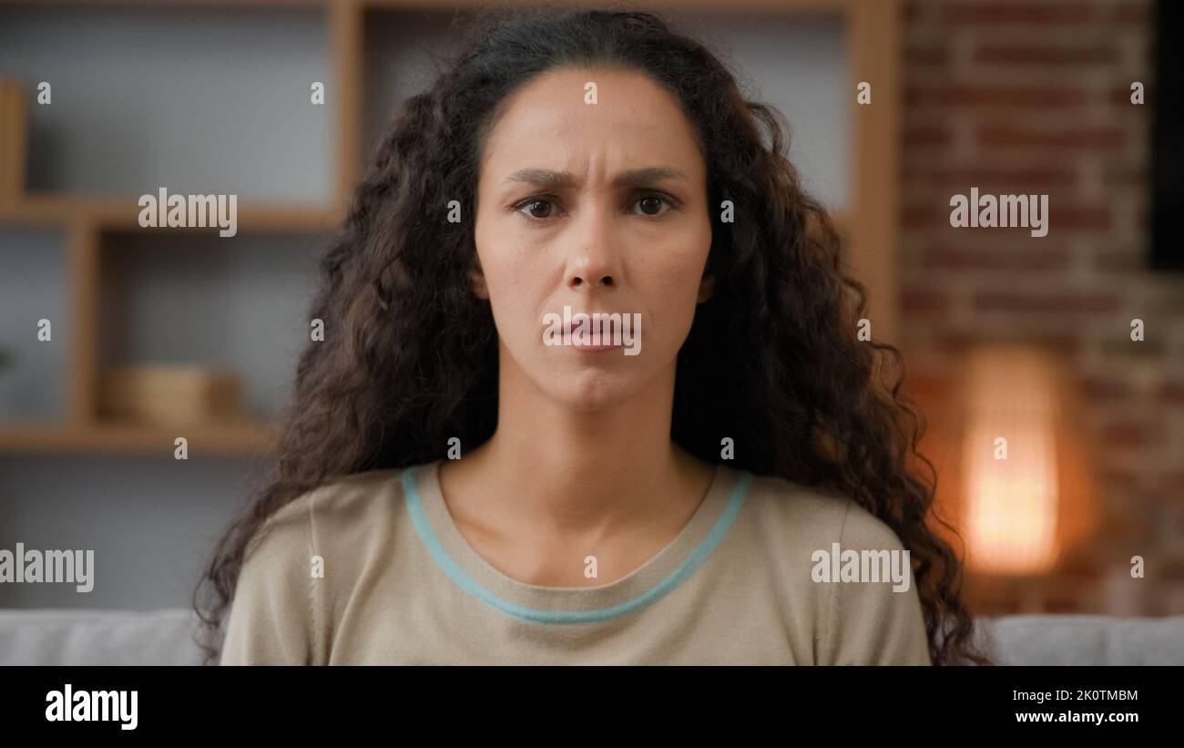 Portrait Hispanic Caucasian woman irritated distraught girl sitting at ...
