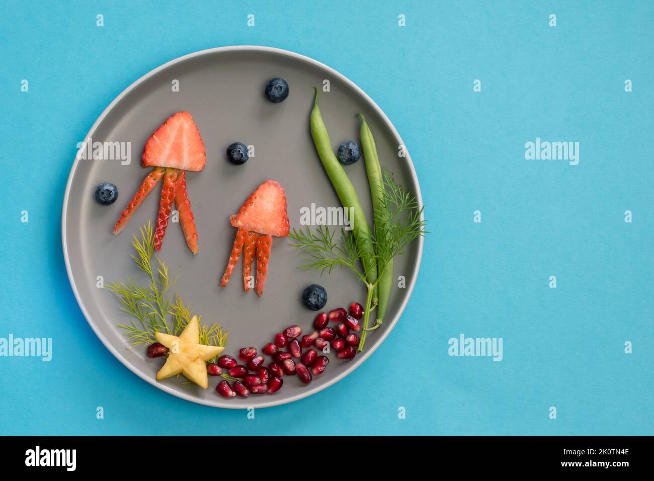 jellyfish, green plants and starfish in sea world from strawberries ...
