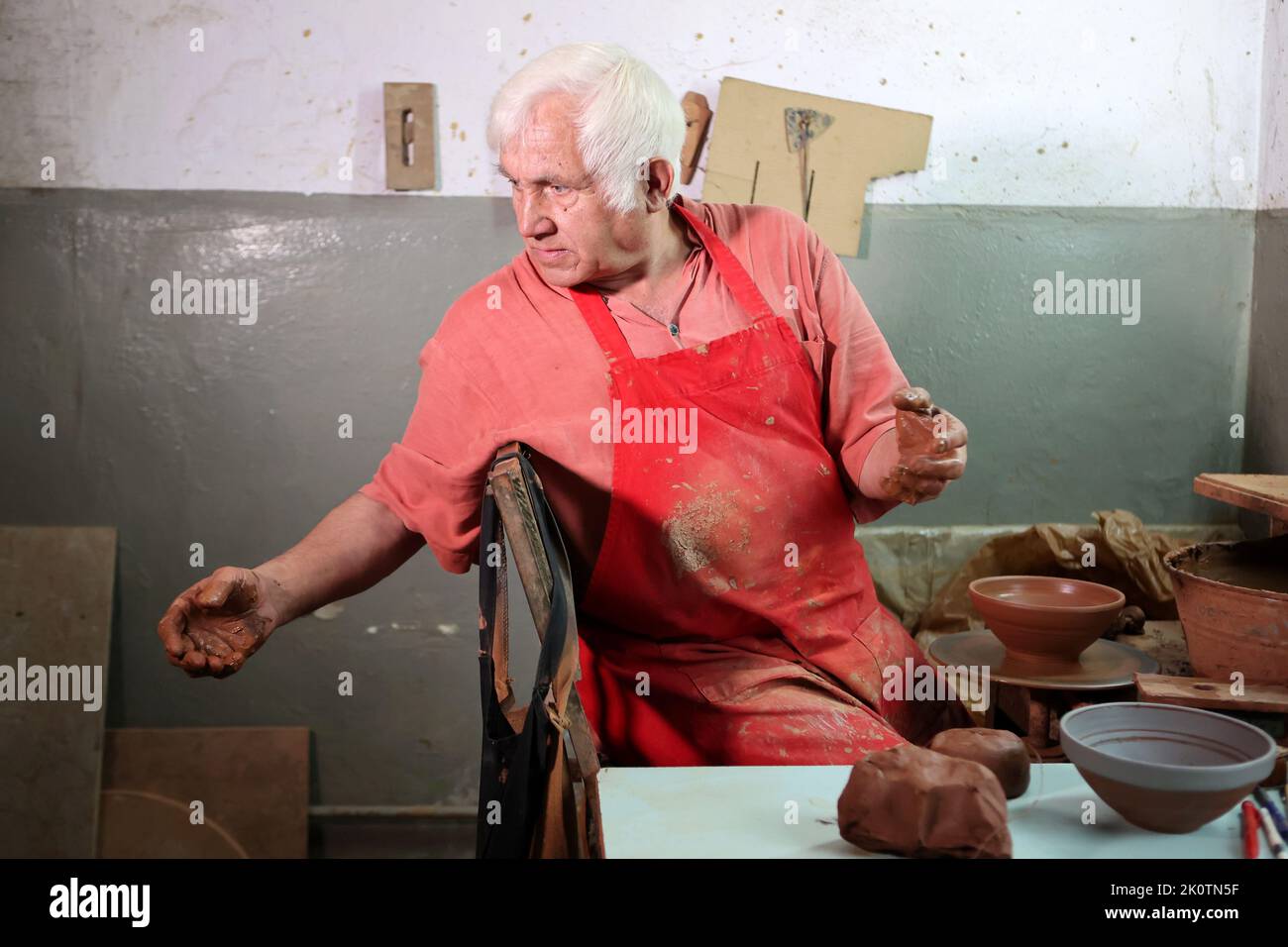 KOSIV, UKRAINE - SEPTEMBER 9, 2022 - Craftsman Mykhailo Sysak works ...
