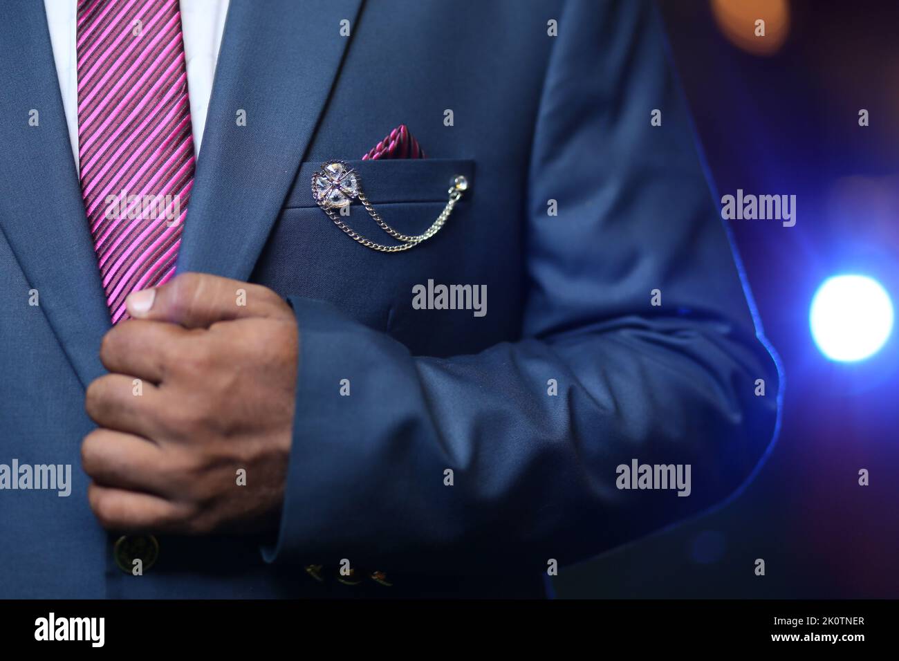 Professional navy blue coat hold with hand, corporate person with coat ...