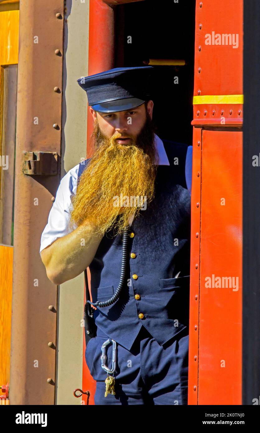 A railroad conductor on The Stourbridge Line, an excursion trail based ...