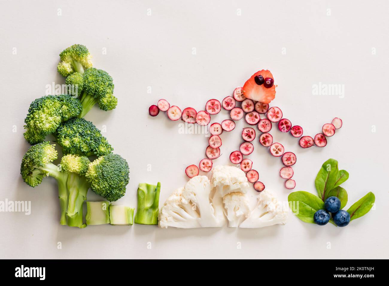 octopus made from red fruits with sea world from cauliflower, broccoli ...