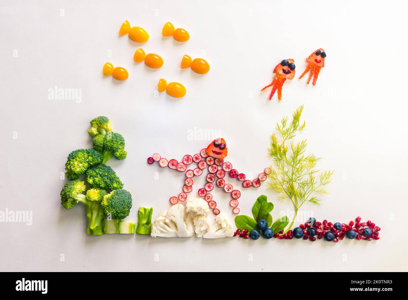 octopus made from red fruits, fish from orange tomato with sea world ...
