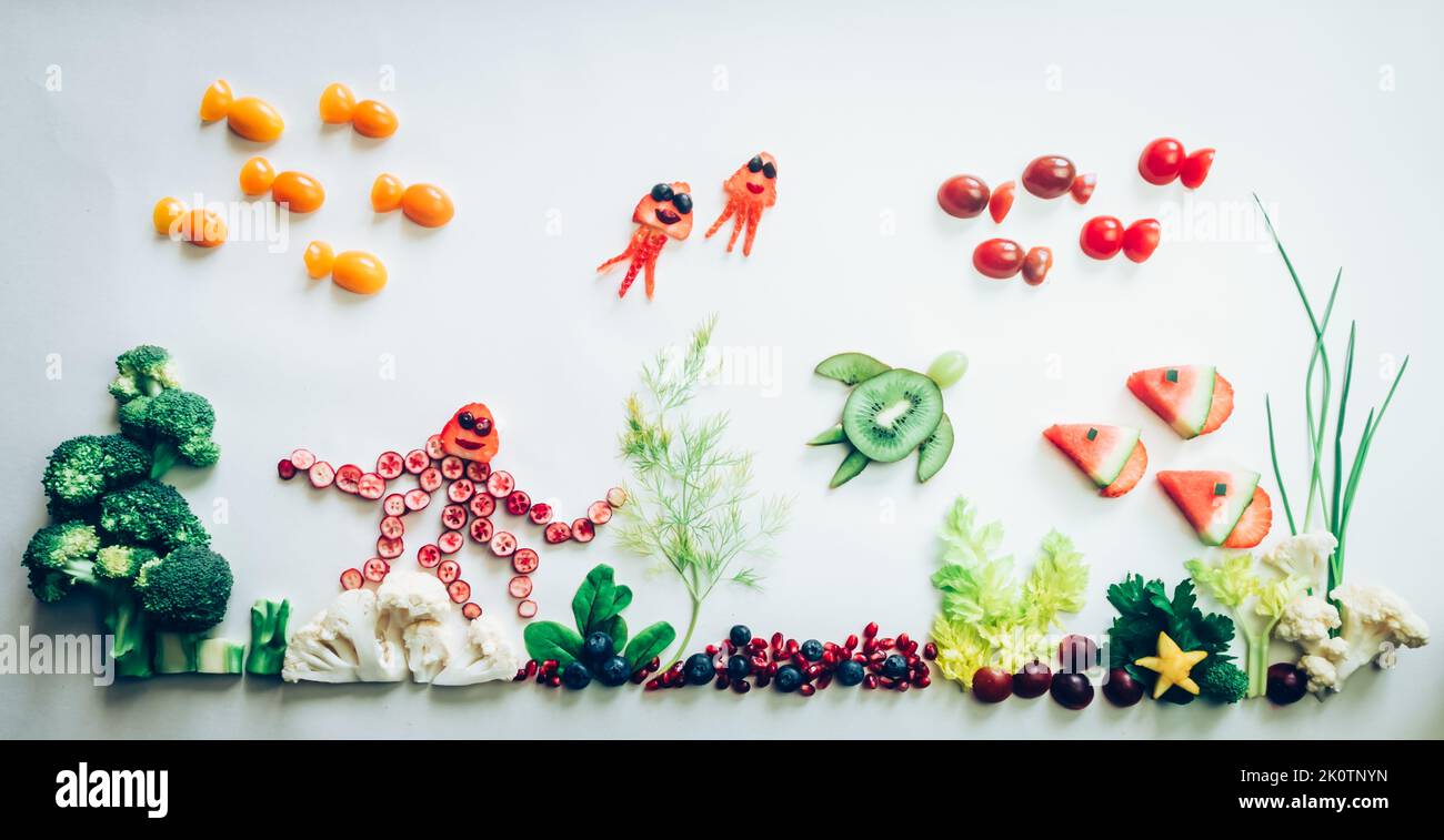 octopus, fishes, jellyfish, starfish made from red fruits, tomato, kiwi ...