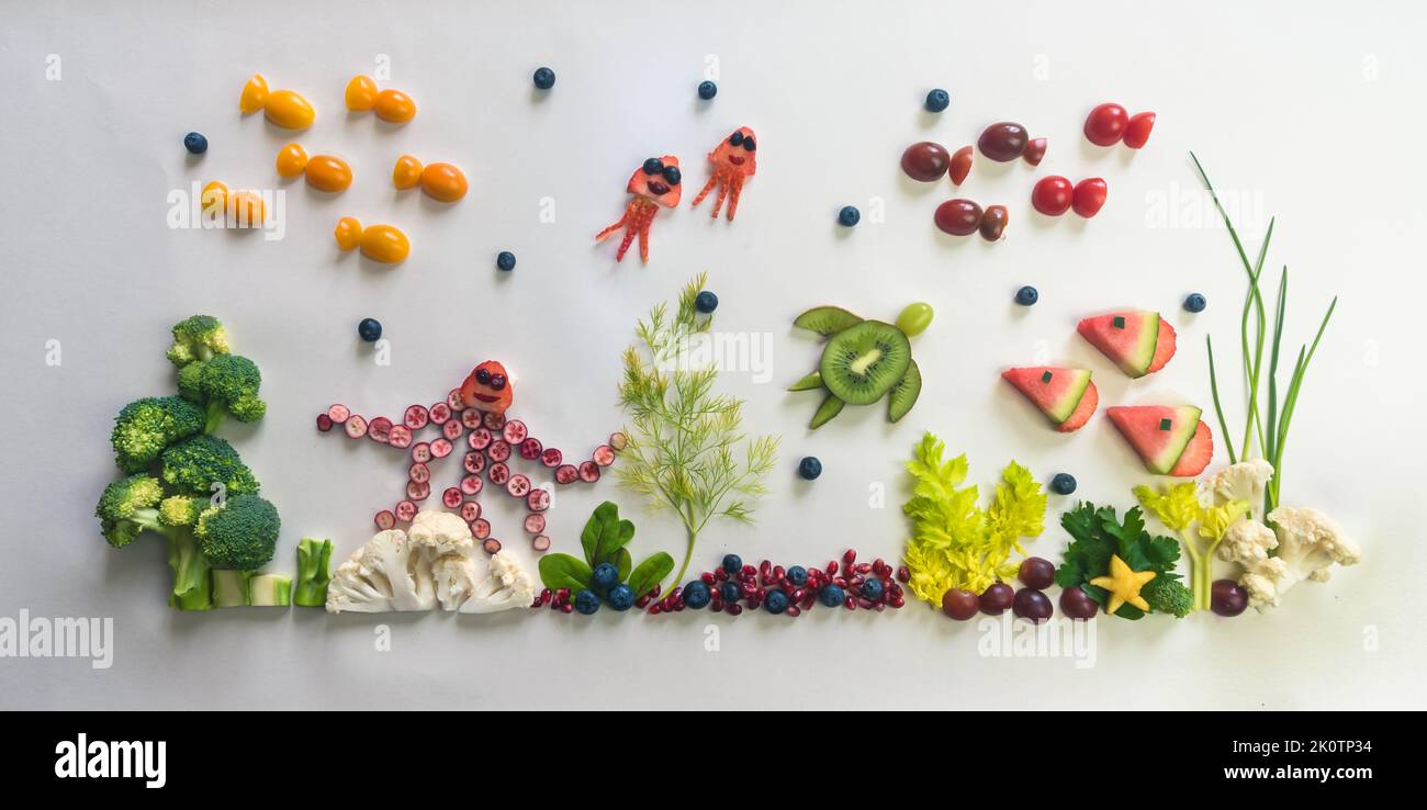 octopus, fishes, jellyfish, starfish made from red fruits, tomato, kiwi ...