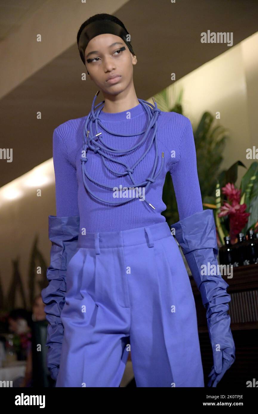 A model walks down the runway at the AKNVAS Spring ’23 Women’s and Men ...