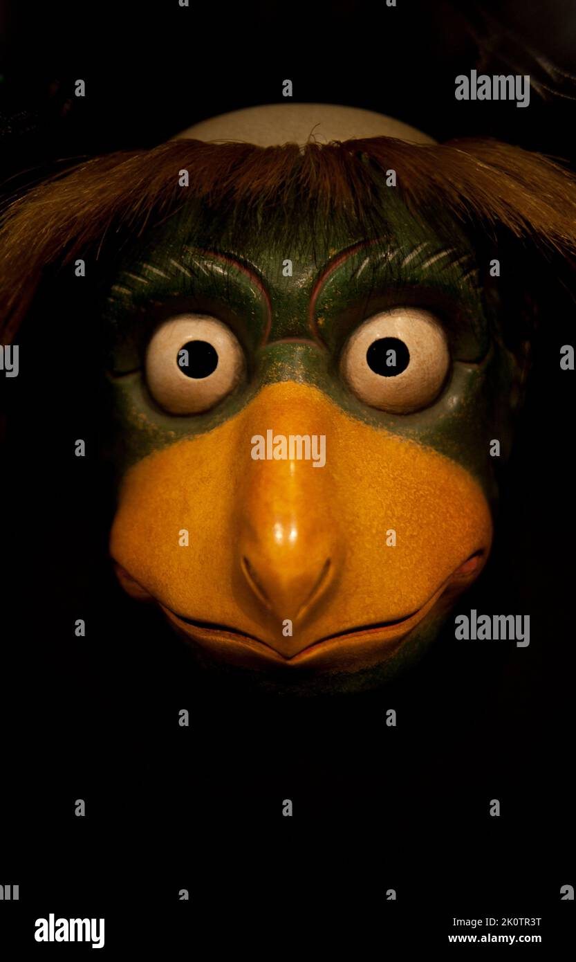 A vertical shot of a Japanese kappa mask used in Noh theatre isolated ...