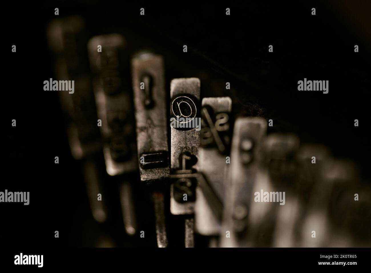 Closeup of old typewriter plates strikers strykers with letters and ...