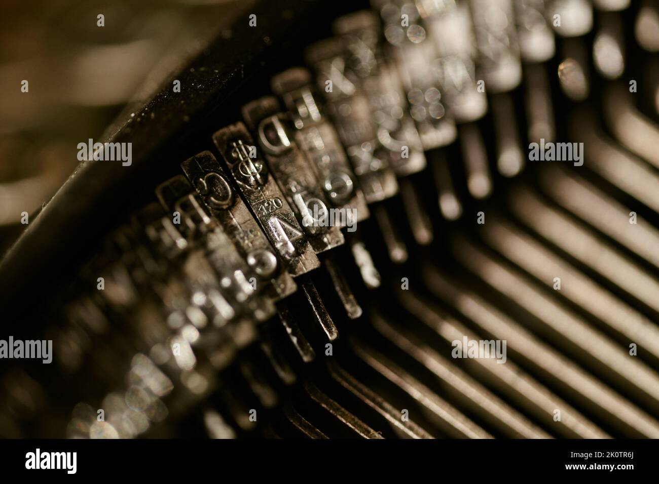 Closeup of old typewriter plates strikers strykers with letters and ...
