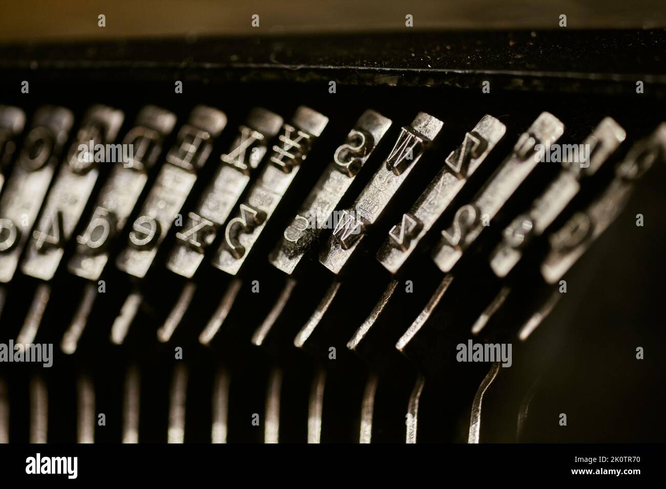 Closeup of old typewriter plates strikers strykers with letters and ...