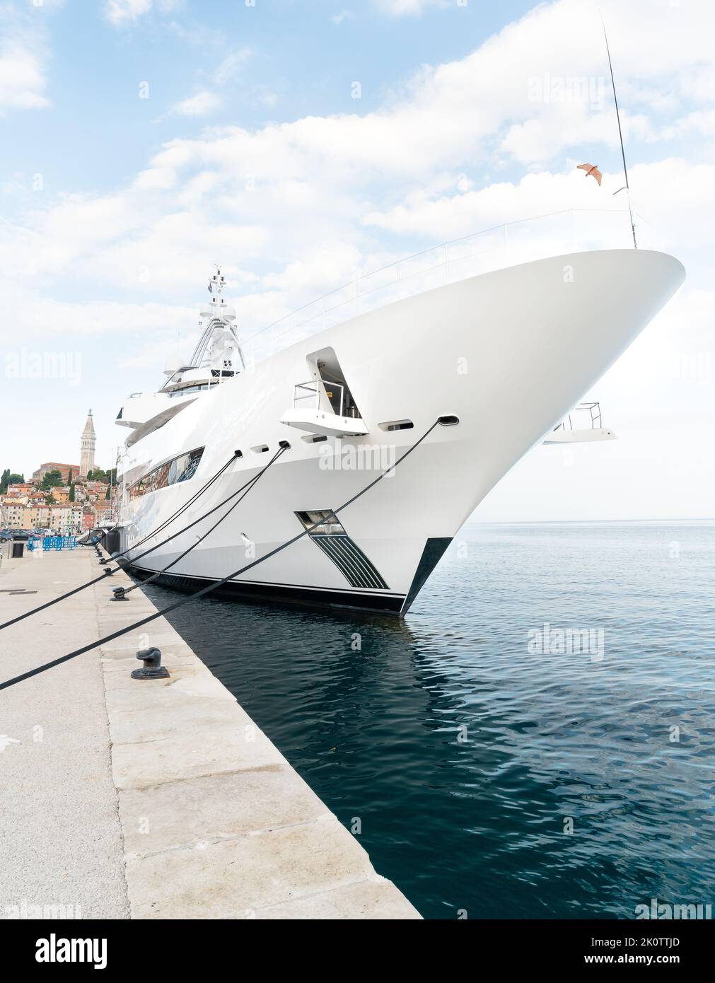A big white ship parked in a port Stock Photo - Alamy