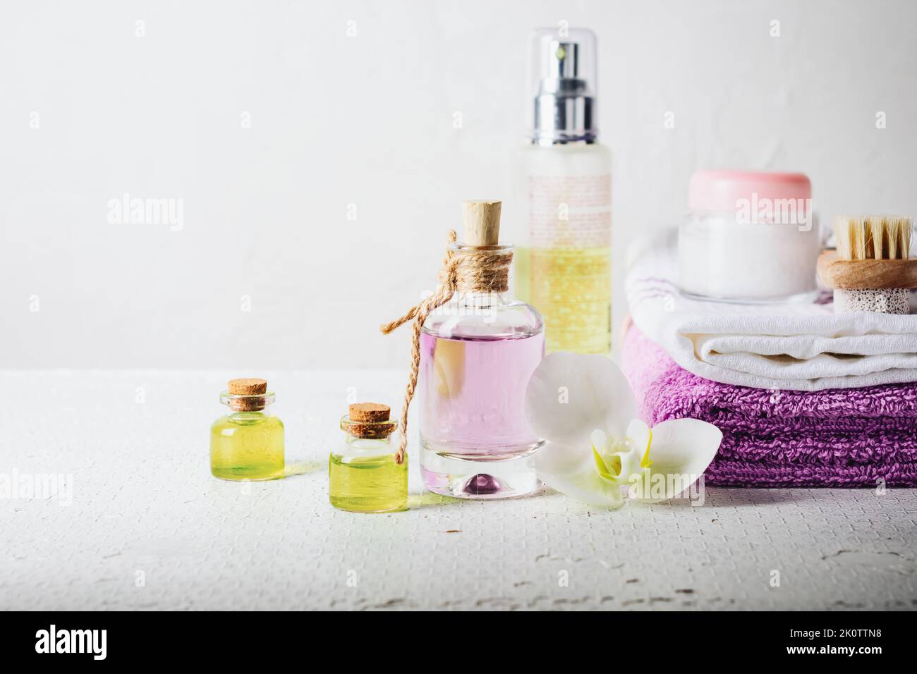 Essential oils, perfumed water in glass bottles on white background ...