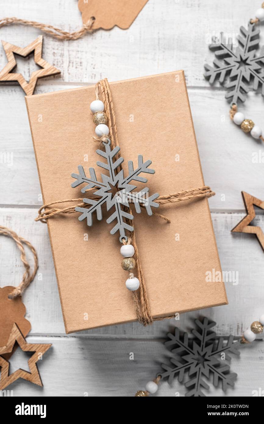 Christmas gift box wrapped in craft paper Stock Photo - Alamy